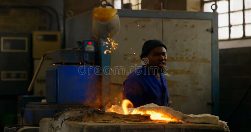 Metal Being Melted in Furnace at Workshop Stock Photo - Image of ...