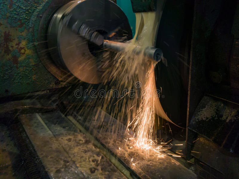 Metal Billet on a Circular Grinding Machine, Flying Sparks from Under a ...