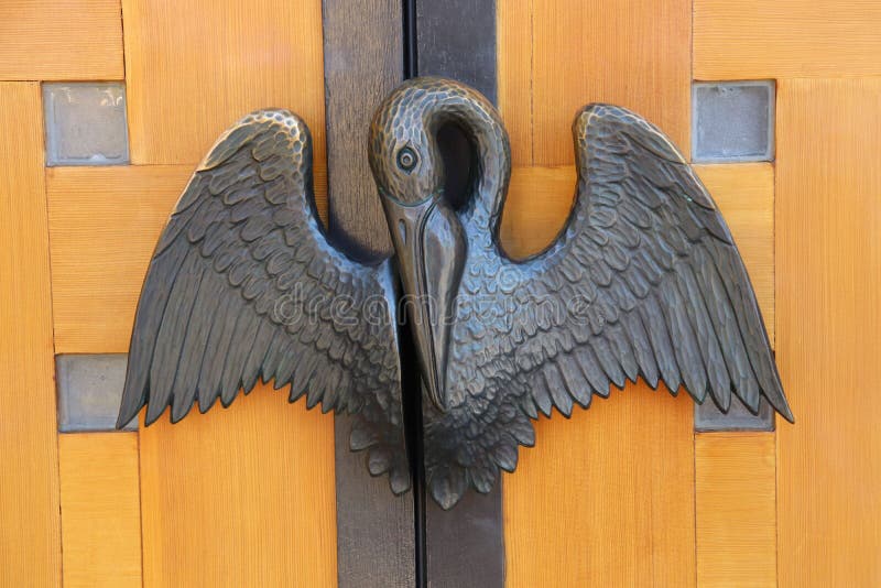 Metal bird door handle editorial photo. Image of steel - 268333981