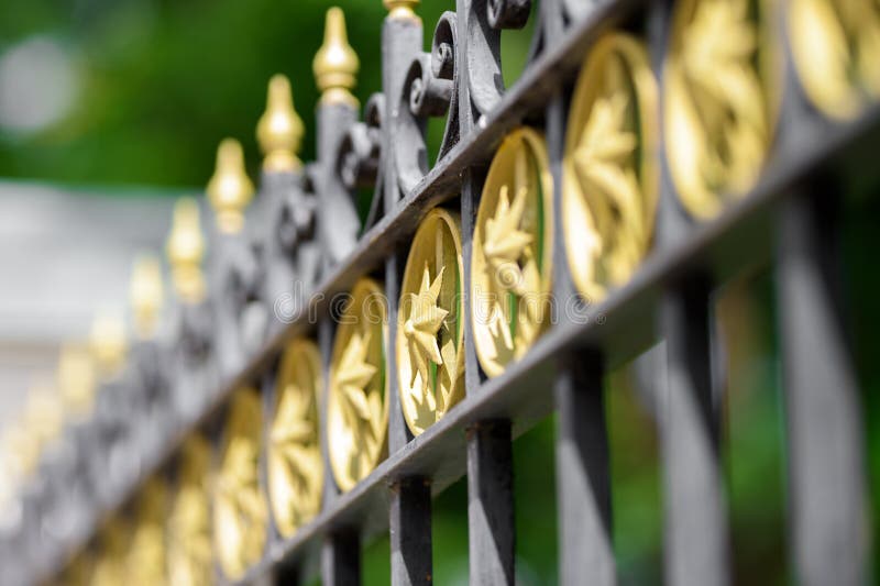 Metal Black Fence with Gold Elements Stock Photo - Image of decorative ...