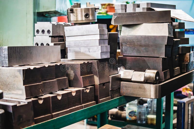 Metal Blocks and Machining Tools Arranged on a Workbench in a ...