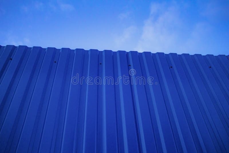 Texture of a Metal Blue Painted Old Dark Fence Wall with a Sky in the ...