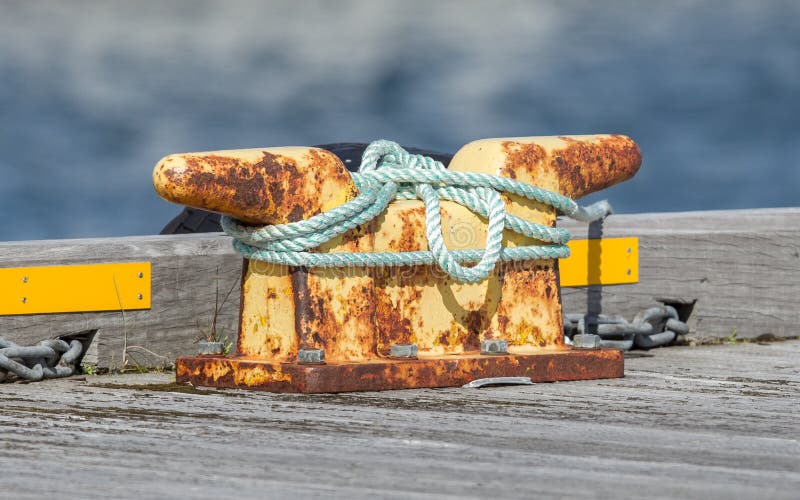 Metal bollard with ropes stock photo. Image of sailing - 77289452
