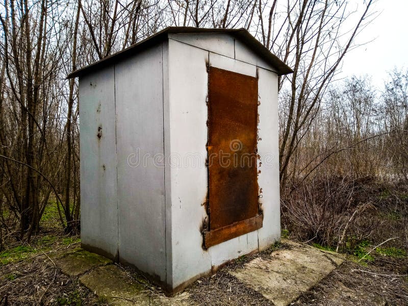 A Metal Booth with Rusty Doors Stands in a Forest Belt Stock Image ...