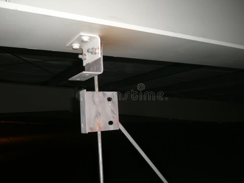 A Metal Bracket Affixed To the Ceiling Supports a Rope, Indicating a ...