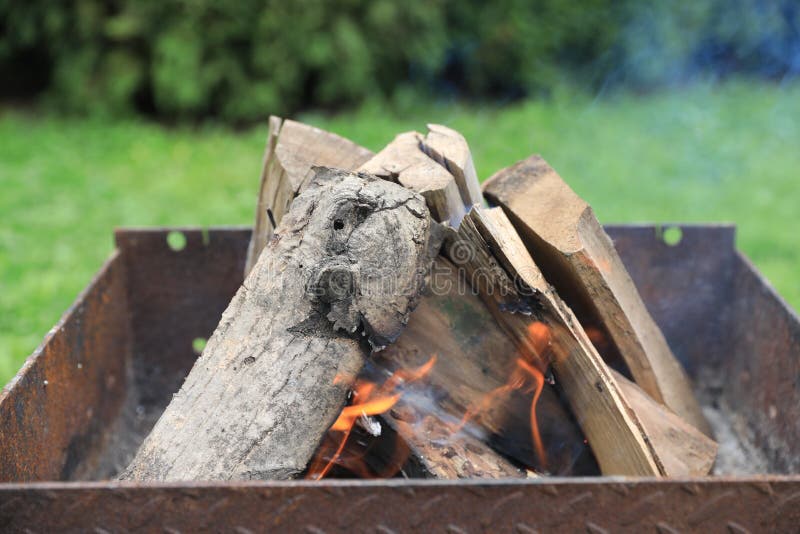Metal Brazier with Burning Firewood Outdoors, Closeup Stock Image ...