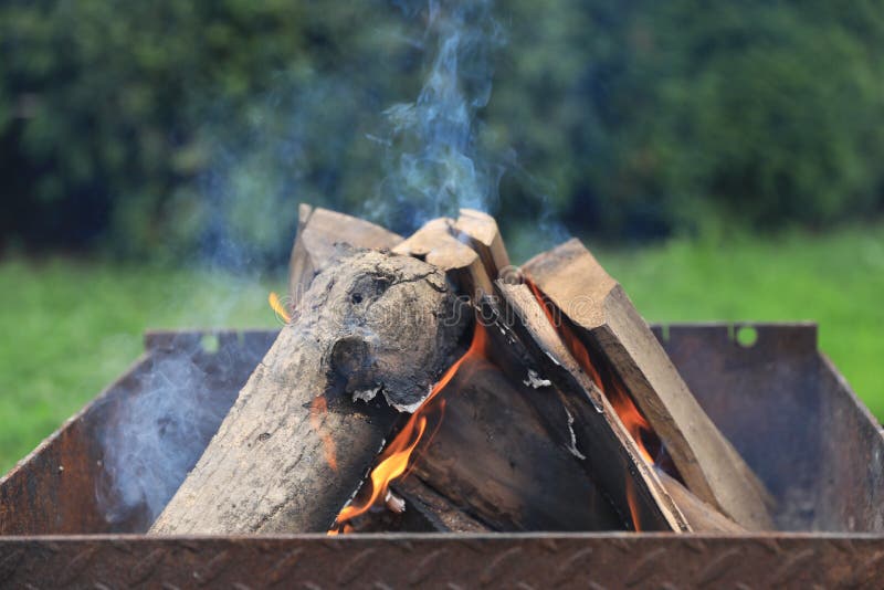 Metal Brazier with Burning Firewood Outdoors, Closeup Stock Image ...