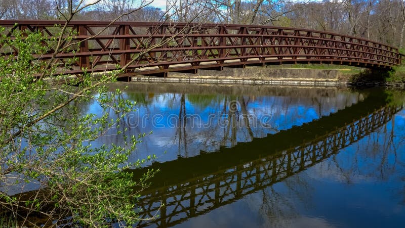 Metal Bridge Over the Canal, Reflection of the Bridge in the Water ...