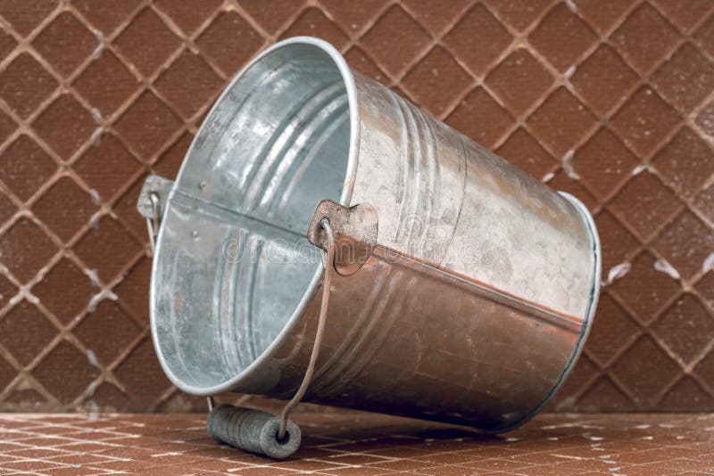 Metal Bucket on the Reverse Side of the Ceramic Tile Stock Image ...