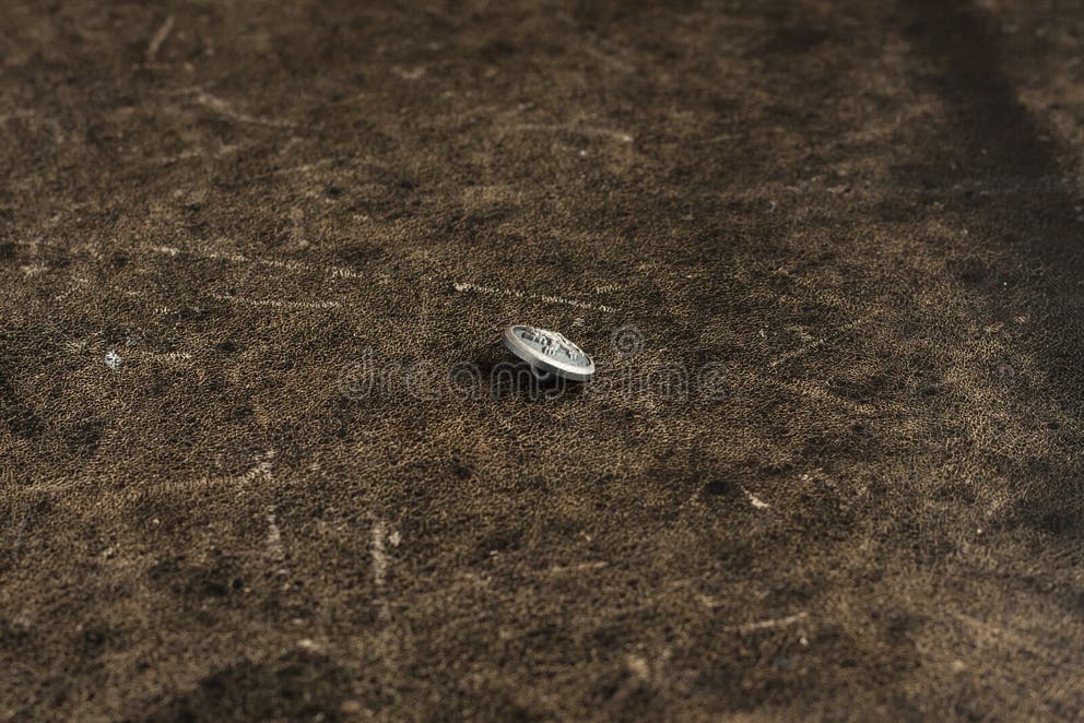 Metal button on table stock photo. Image of hole, button - 94686190