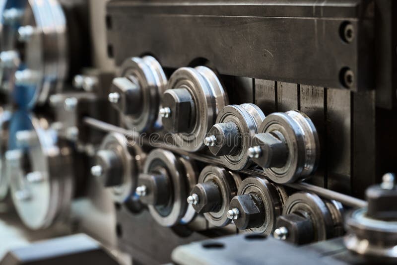 Metal Cable Pulled Out through Rollers Line on Machine Tool Stock Photo ...