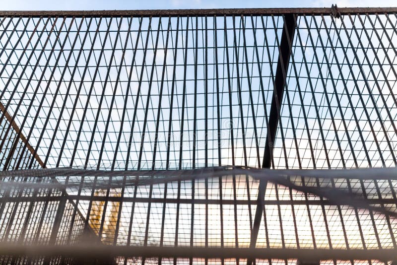Metal cage in a prison stock photo. Image of sunset - 203267624