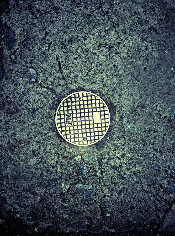 Metal cap on the road editorial stock photo. Image of carved - 48386153