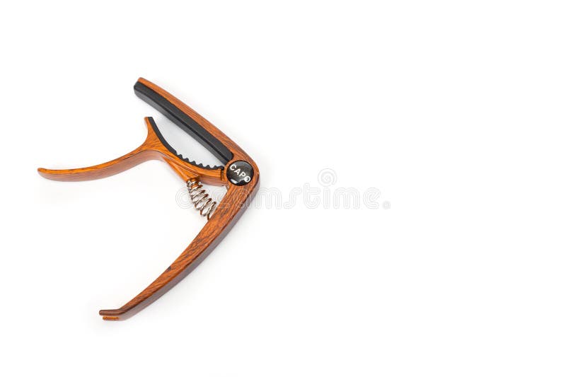 Metal Capo for Guitar with Spring Painted Wood Stock Photo - Image of ...