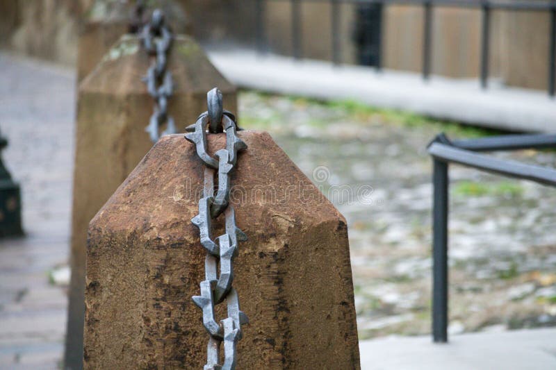 .a Metal Chain that is Attached To Two Stone Posts Stock Photo - Image ...