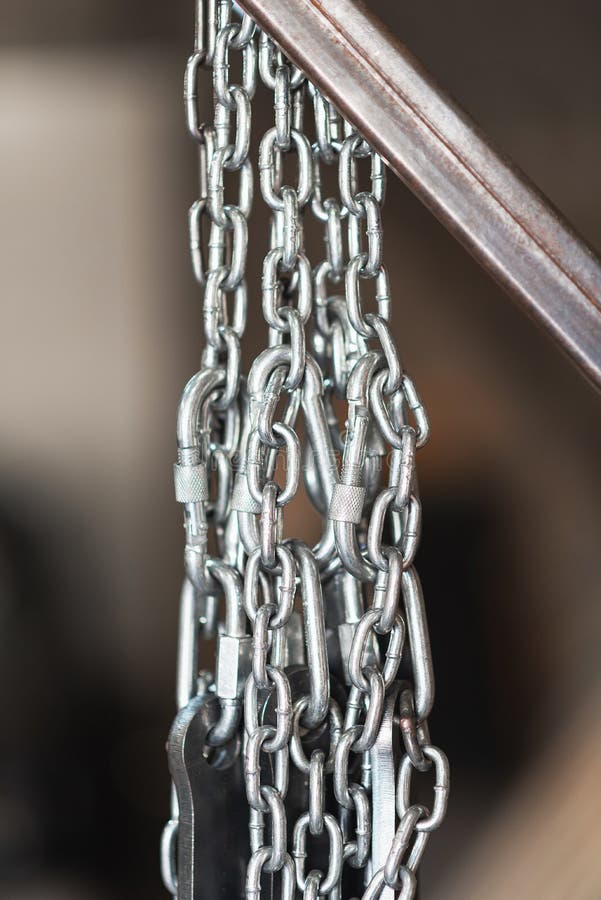 Metal chains in a workshop stock photo. Image of metallic - 180363108