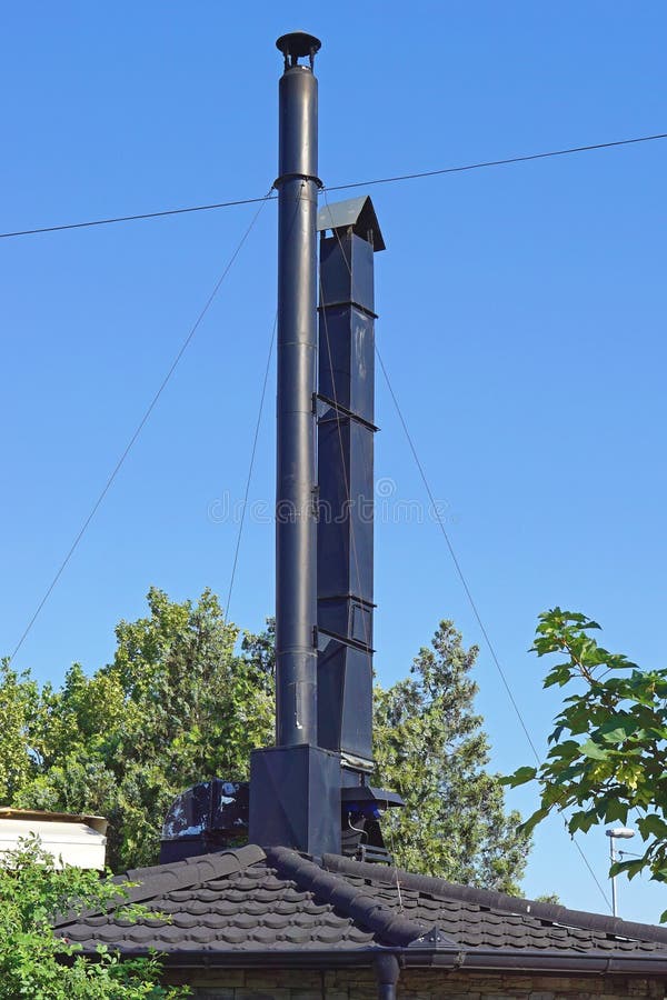 Two metal chimneys stock image. Image of framework, vertical - 920263