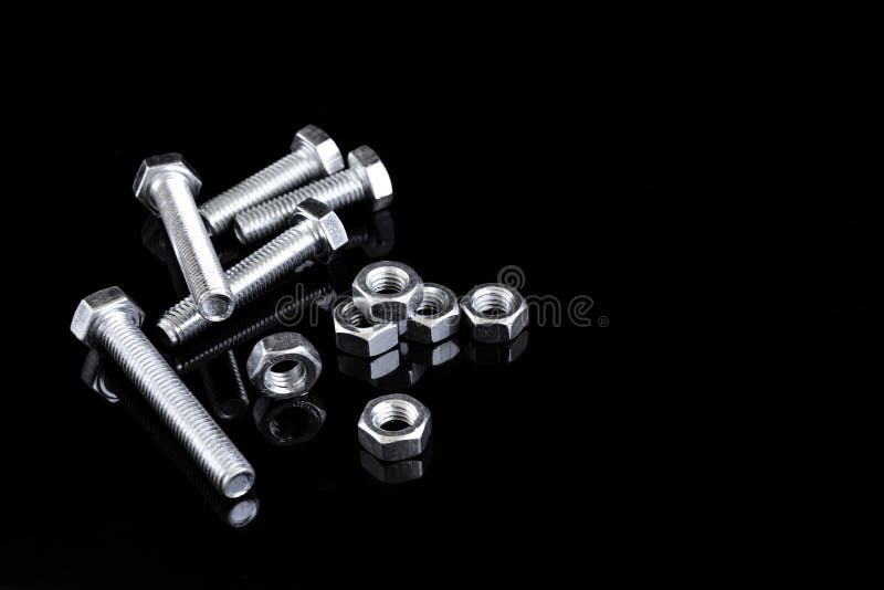 Metal Chrome Bolts and Nuts Isolated on Black Background Stock Photo ...