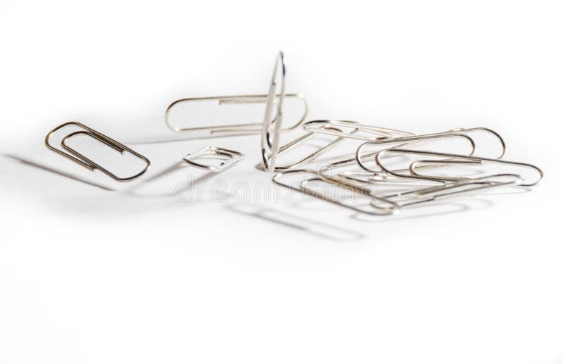 Metal Clips Jumping To Music on a White Background Stock Photo - Image ...