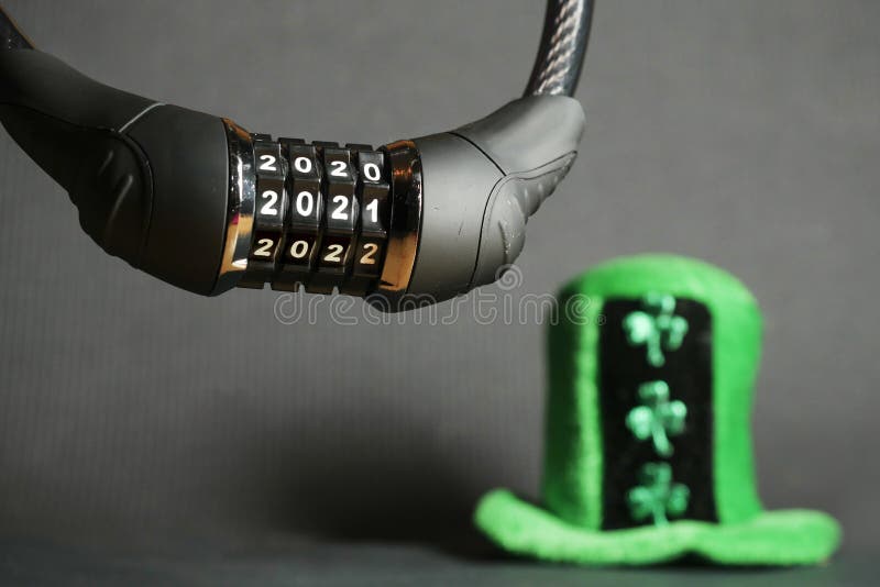 Metal Code Lock with Numbers 2021 in Focus. Green Hat with Shamrock in ...