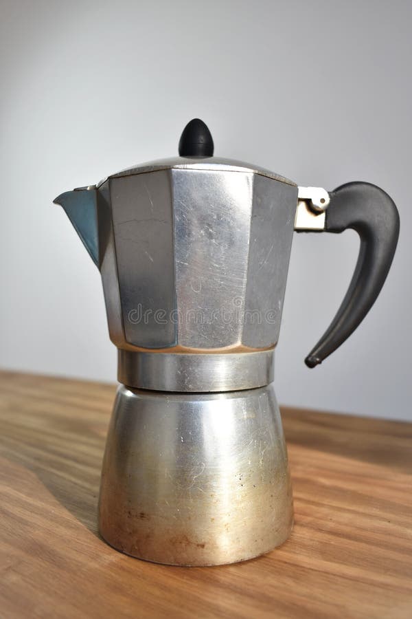 A Metal Coffee Maker on a Wood Table Stock Image - Image of group ...