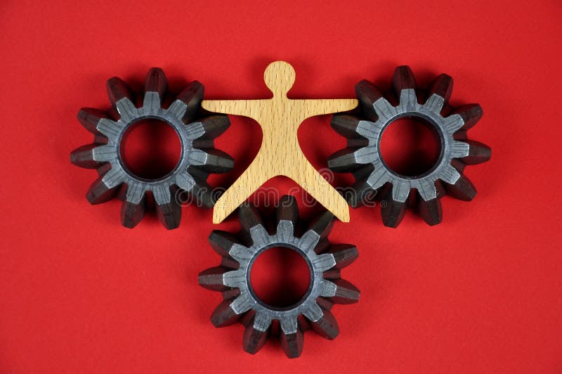 Metal Cogs Cogwheels and a Figure of a Man Made of Wood Stock Image ...