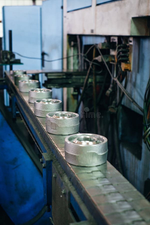 Metal Components Move Along a Conveyor Belt in an Industrial Facility ...