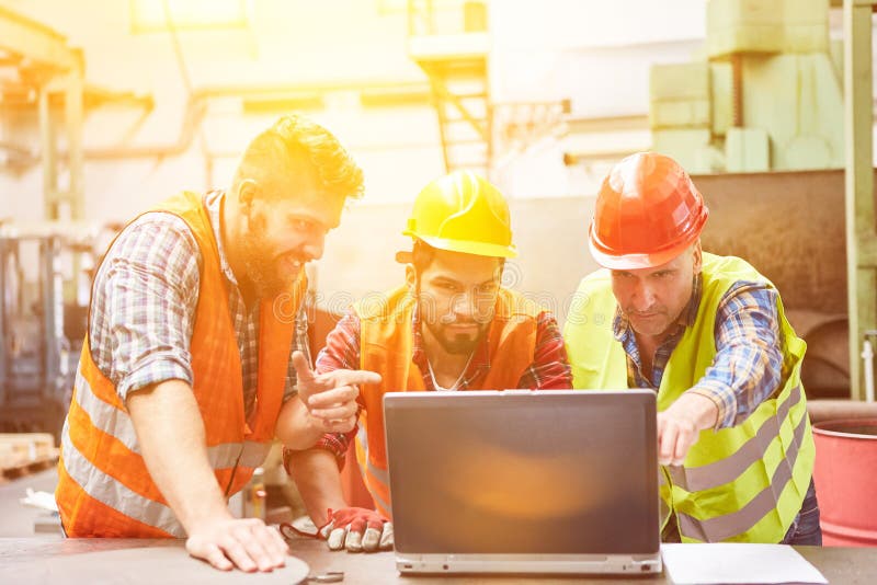 Metal Construction Workers Team at Laptop Computer Stock Photo - Image ...