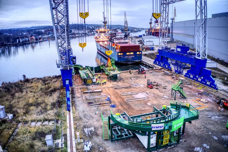 Metal Constructions Loading Onto a Ship by Docks Machinery Editorial ...