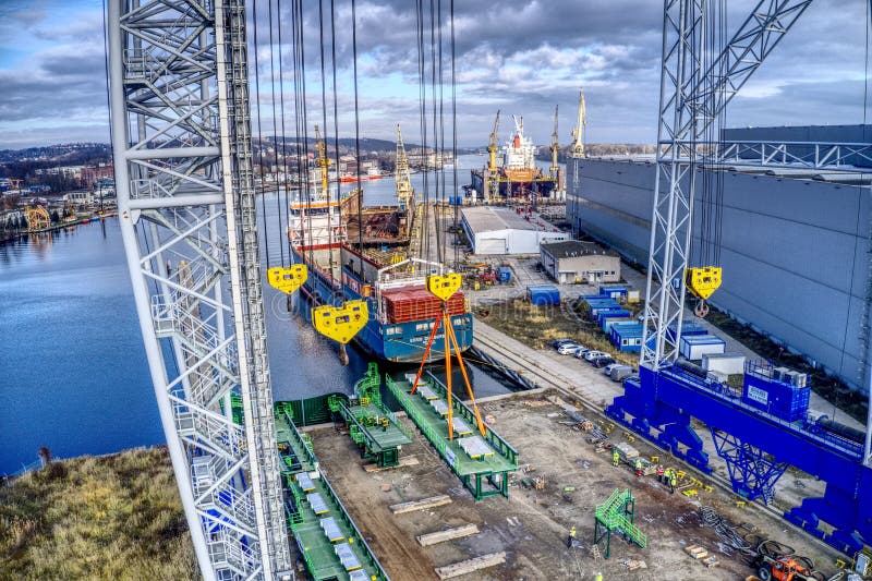 Metal Constructions Loading Onto a Ship by Docks Machinery Editorial ...