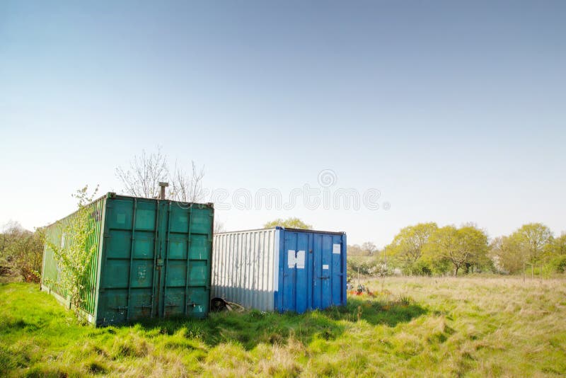 Metal Containers in a Field Stock Image - Image of building, farmland ...