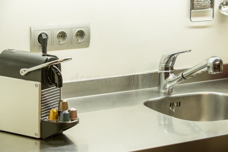 Metal Countertop in a Kitchen with a Capsule Coffee Machine Stock Image ...