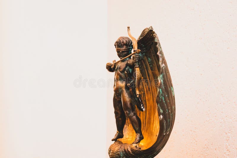 Metal cupid on a stand stock image. Image of cupid, feast - 186881361