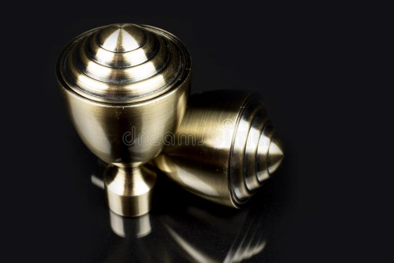 Metal Curly Items on a Black Background with Reflection Stock Photo ...