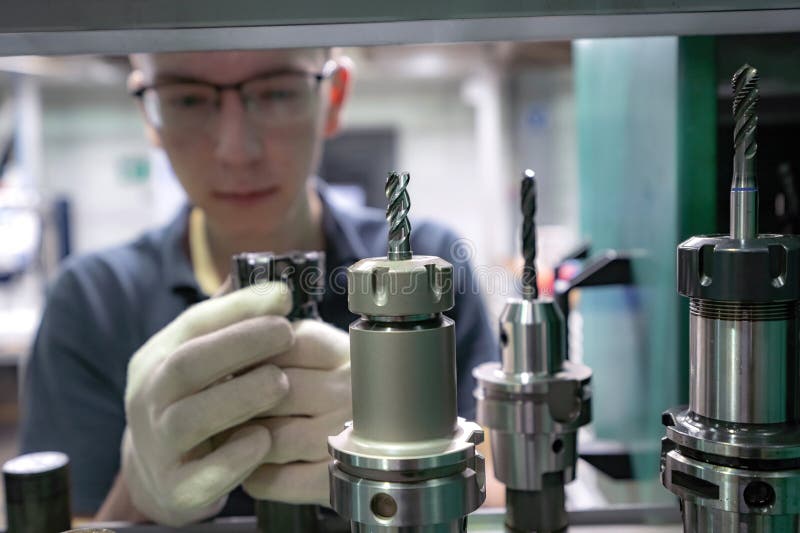 Metal-cutting Cutters for a CNC Machine in the Hands of a Worker To ...