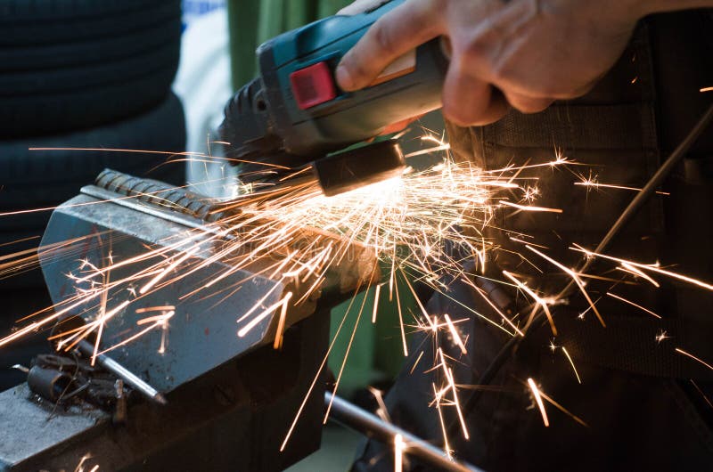 Metal Cutting with a Grinding Machine with Sparks. Stock Photo - Image ...