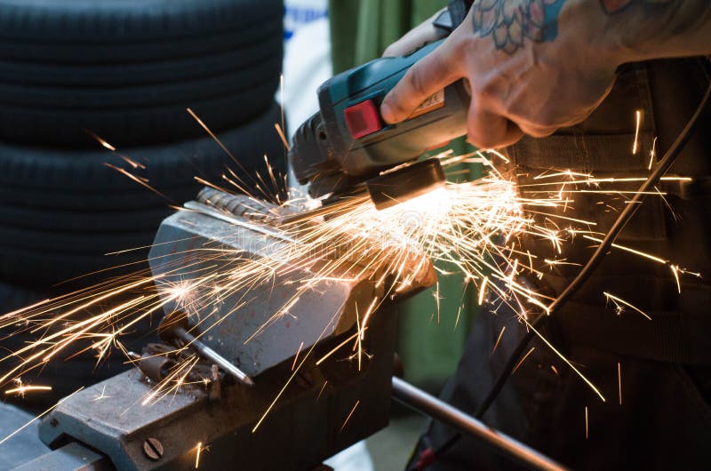 Metal Cutting with a Grinding Machine with Sparks. Stock Photo - Image ...