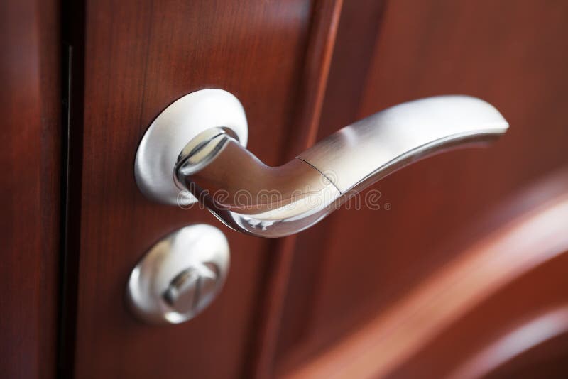 The Metal Door Handle on a Brown Door Stock Image - Image of home ...