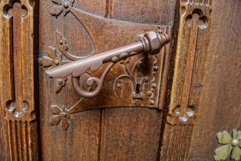 Metal Door Handle with a Floral Pattern in a Vintage Style Stock Photo ...