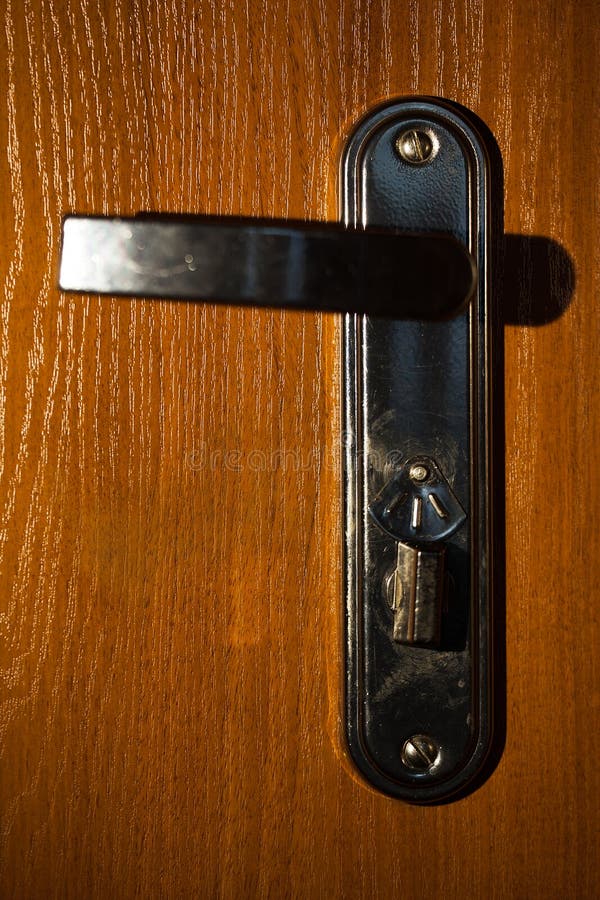 Metal Door Handle with Lock on Wooden Door Stock Image - Image of ...