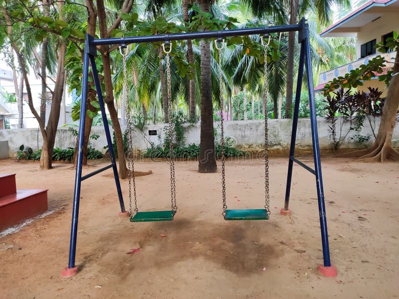 Metal Double Chain Swings in the Park Stock Photo - Image of lawn ...