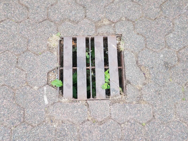 Metal Drain on Ground with Hexagon Tiles Stock Photo - Image of tiles ...