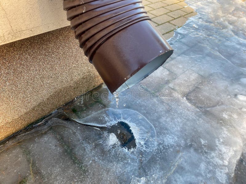 Metal Drain Pipe Installed on the Wall of the Building, Water Leaking ...