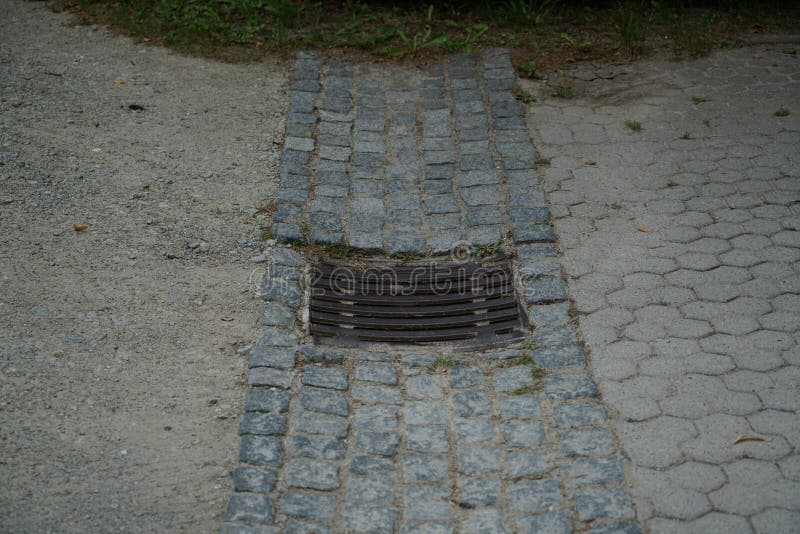 Metal Drainage on Cobblestone Path Stock Image - Image of granite ...