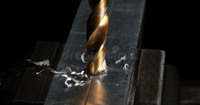 Metal Drill Turning on a Steel Plate Making Chips Stock Photo - Image ...