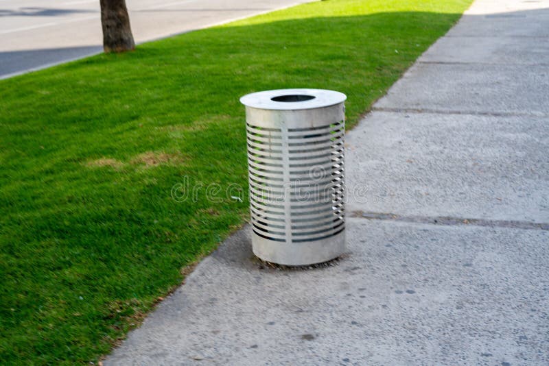 Metal Dustbin on the Sidewalk in the Street Stock Photo - Image of ...