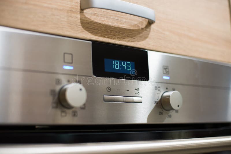 Metal Electric Kitchen Oven Control Panel Stock Photo - Image of clock ...