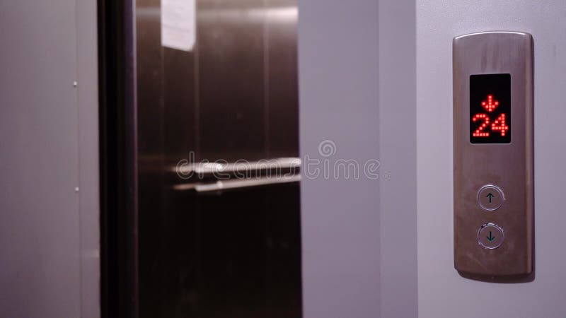 Metal Elevator Doors Open, with the Elevator Call Button in the ...