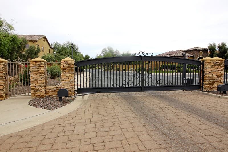 Metal Exit Gate with Flagstone Columns Stock Photo - Image of walk ...