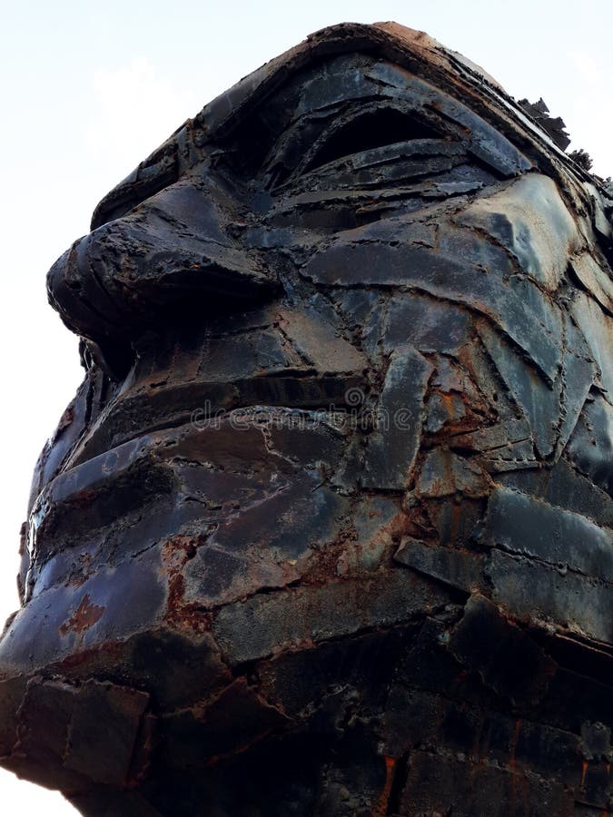 Metal face sculpture stock image. Image of park, solder - 52041593